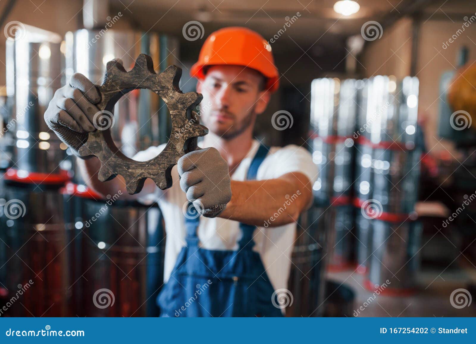 Fine Material. Man in Uniform Works on the Production Stock Photo ...