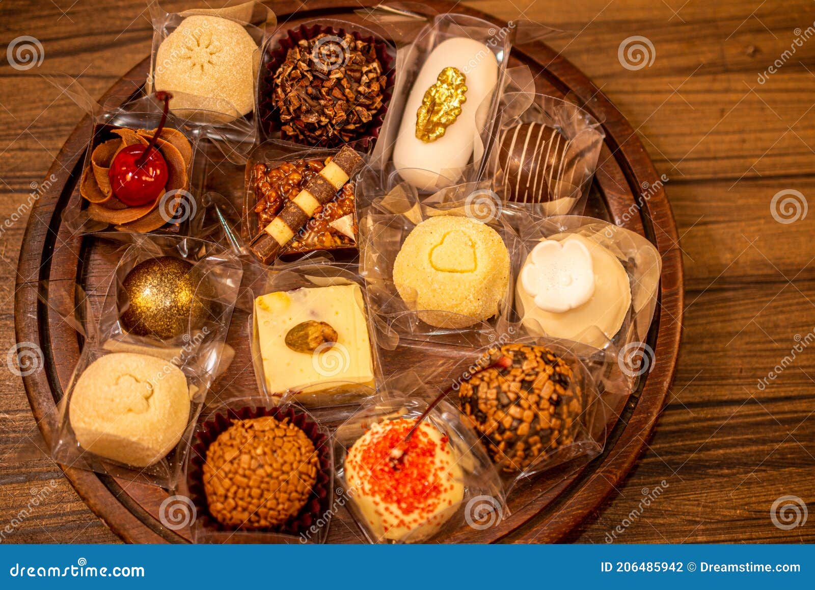 Fine Sweets for Parties with Chocolate and Cherry. Decorated on a ...