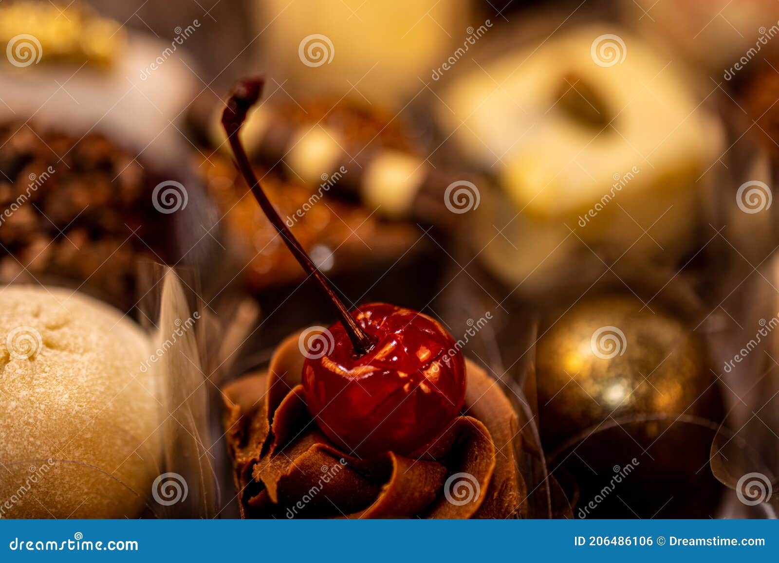 Fine Sweets for Parties with Chocolate and Cherry. Decorated on a ...