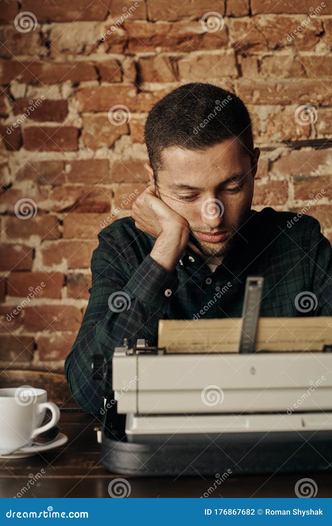 Fine Young Writer Working on a Classic Typewriter. he is Happy and in ...