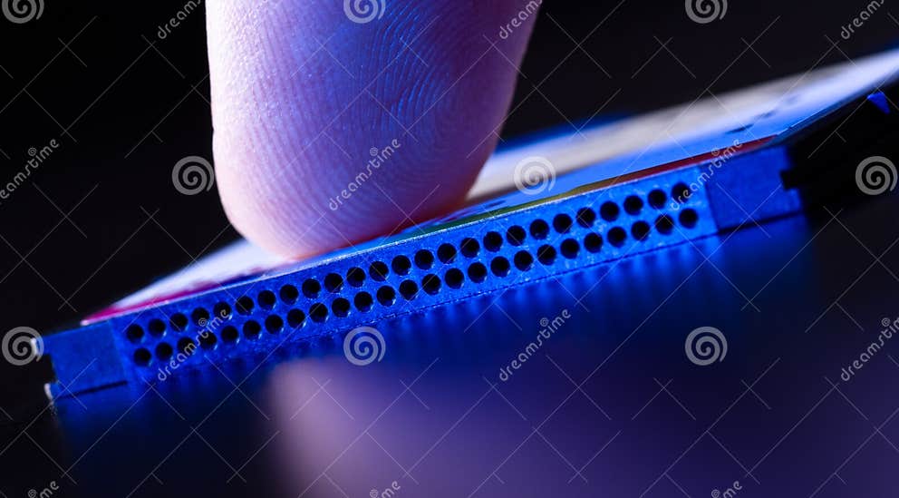 Finger on Flash Card in Blue Light Closeup Stock Image - Image of plug ...