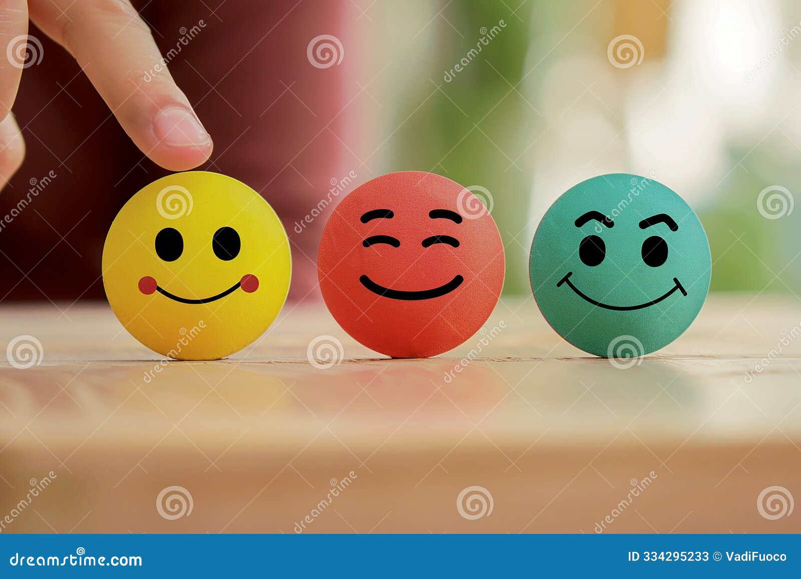 The Finger of the Hand Points To Three Multi-colored Balls with ...