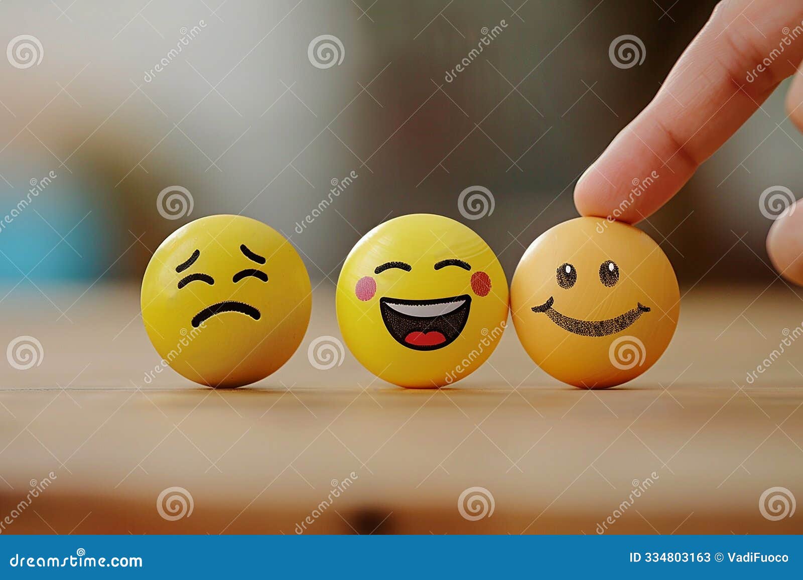 The Finger of the Hand Points To Three Multi-colored Balls with ...