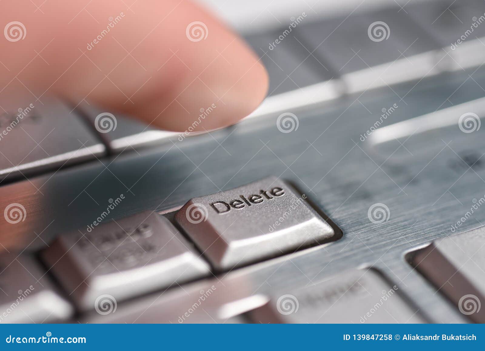 Finger Hand Presses the Delete Button on the Keyboard, Close-up Stock ...
