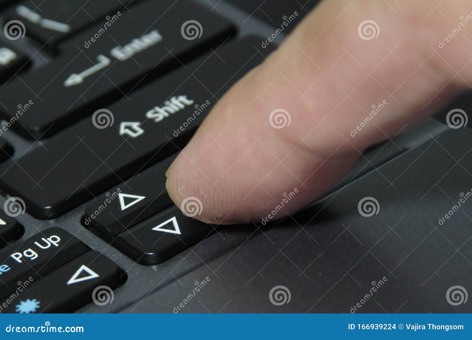 A Finger Hitting Computer Keyboard Arrow Signs on Notebook Keyboard ...