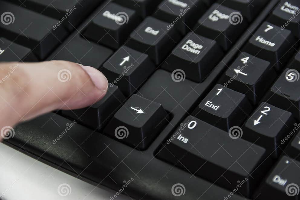 A Finger Hitting Computer Keyboard Arrow Signs on PC Keyboard Stock ...