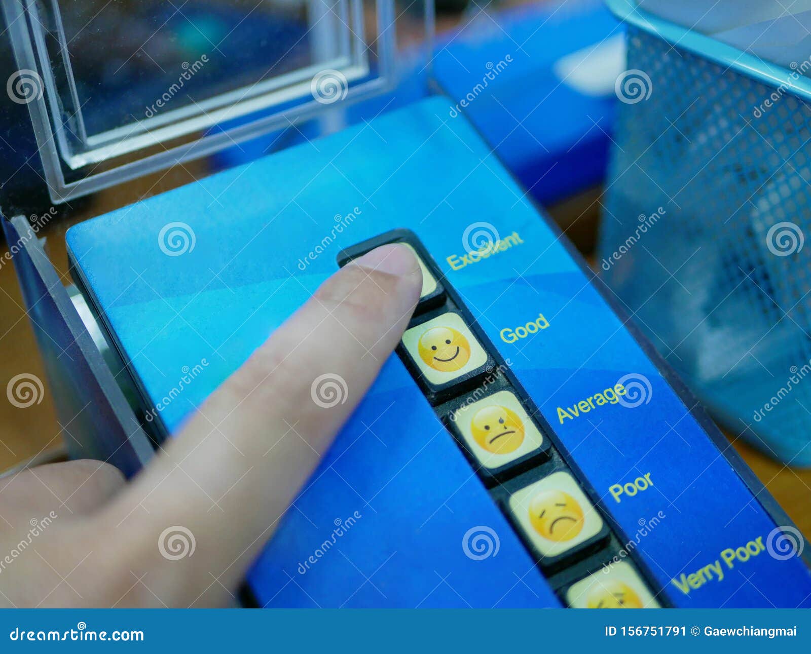 A Finger of a Man on a Push Button Feedback Device for Customer`s ...