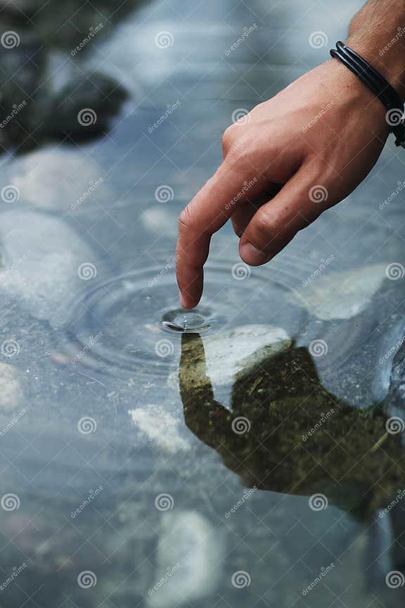Finger of Man Touching the Surface of Water Stock Photo - Image of soft ...