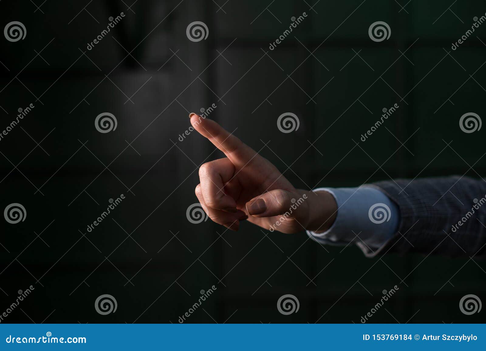 Finger Pointing in the Empty Space. Dark Background with Hand Pointing ...