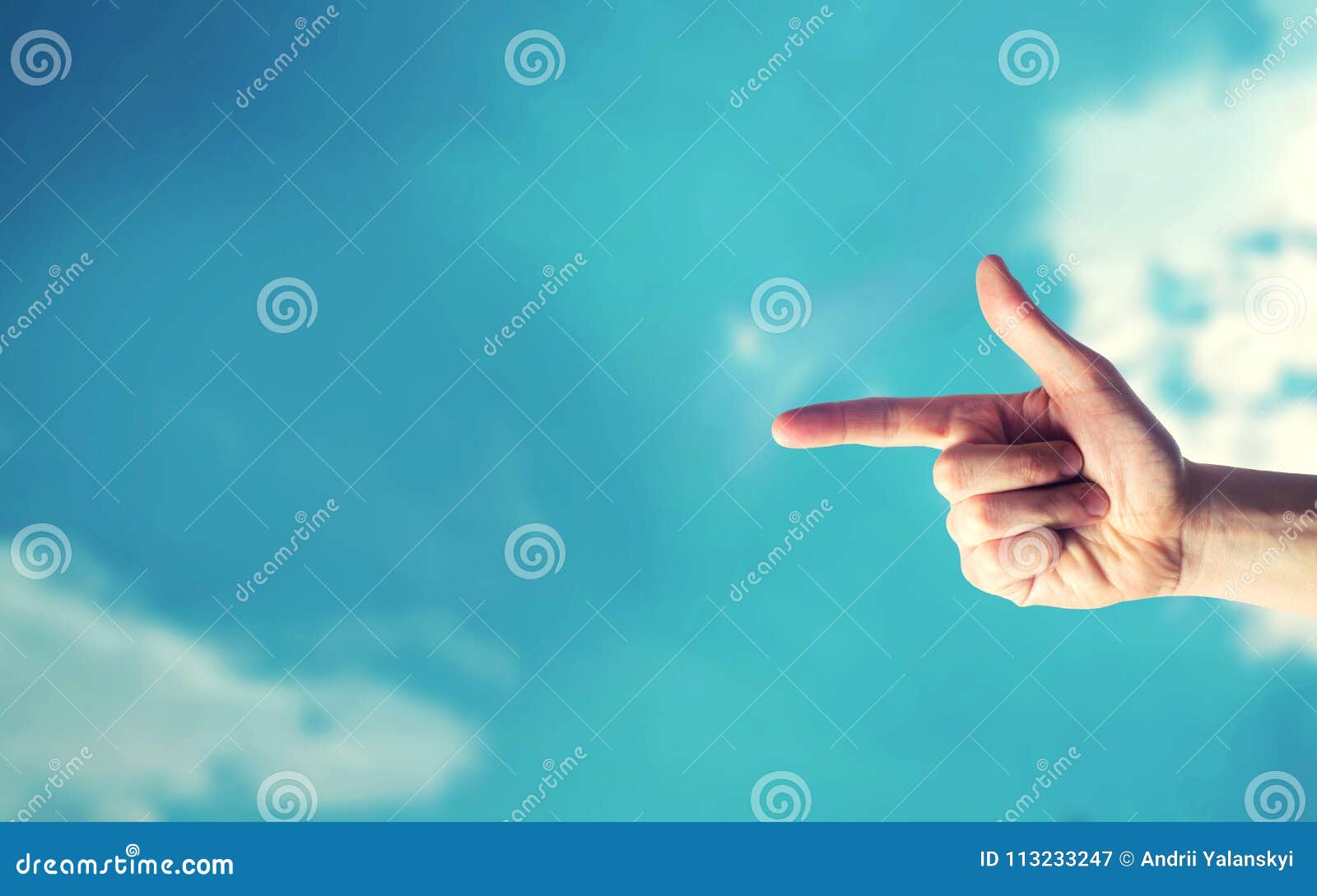 Finger Pointing at Something and Blue Sky, Place for Text Stock Image ...