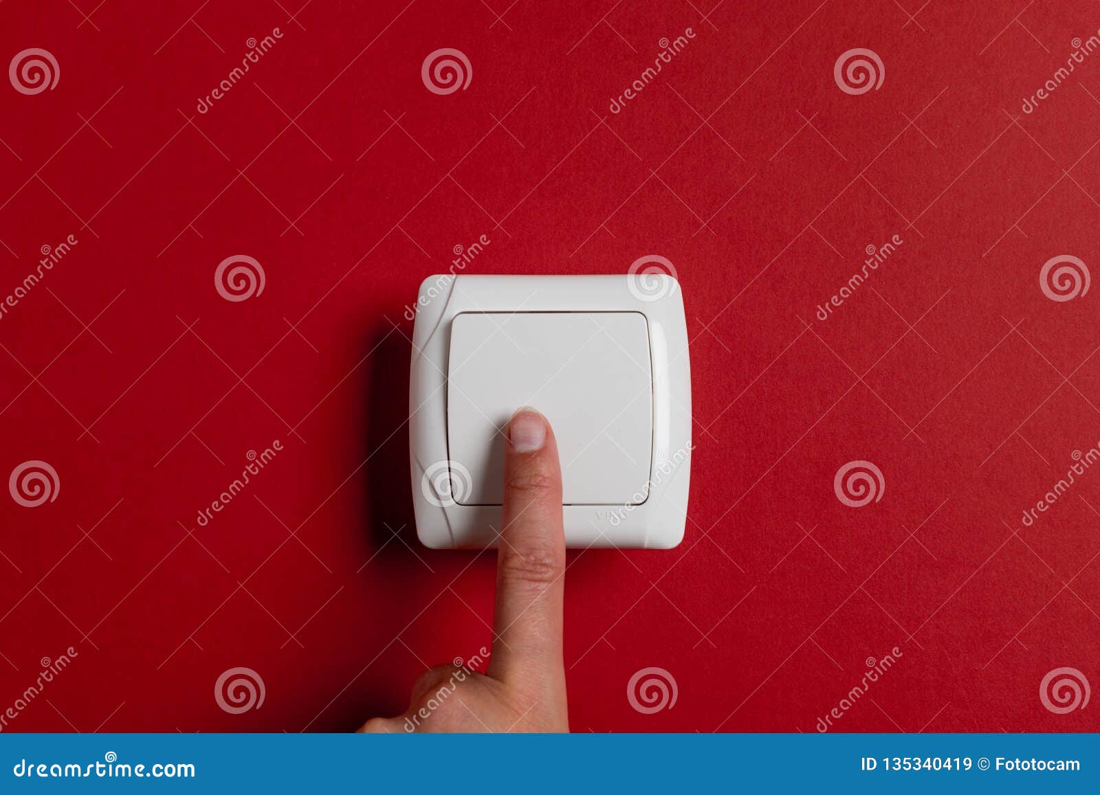 Finger Press Light Switch on a Bright Red Background Stock Image ...