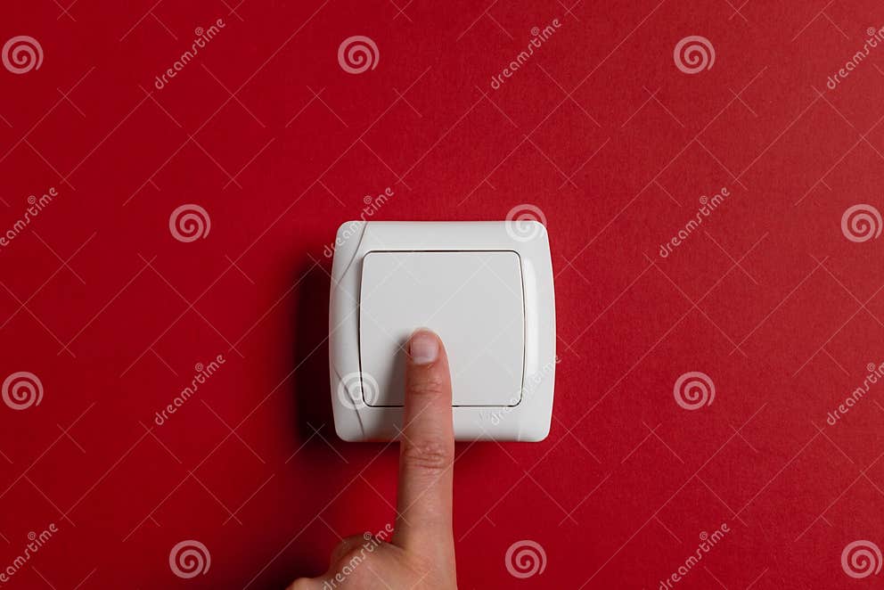 Finger Press Light Switch on a Bright Red Background Stock Image ...