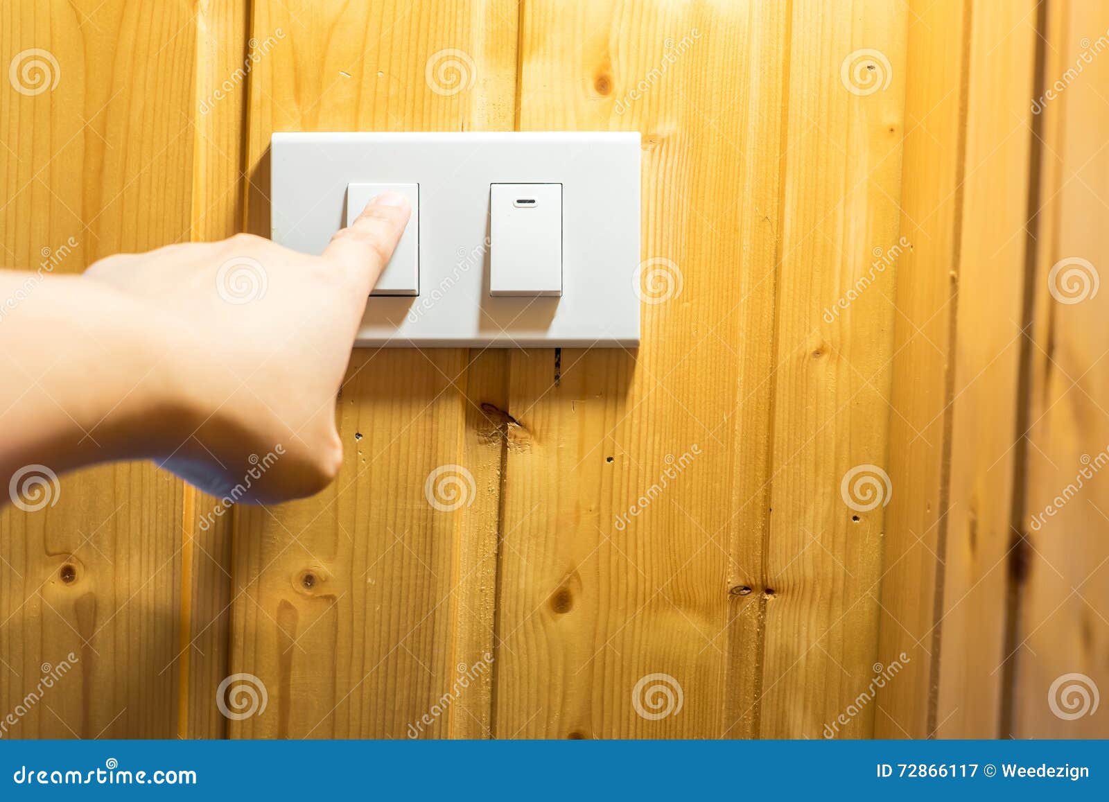 Finger Press on Light Switch Button at Wooden Wall Stock Image - Image ...