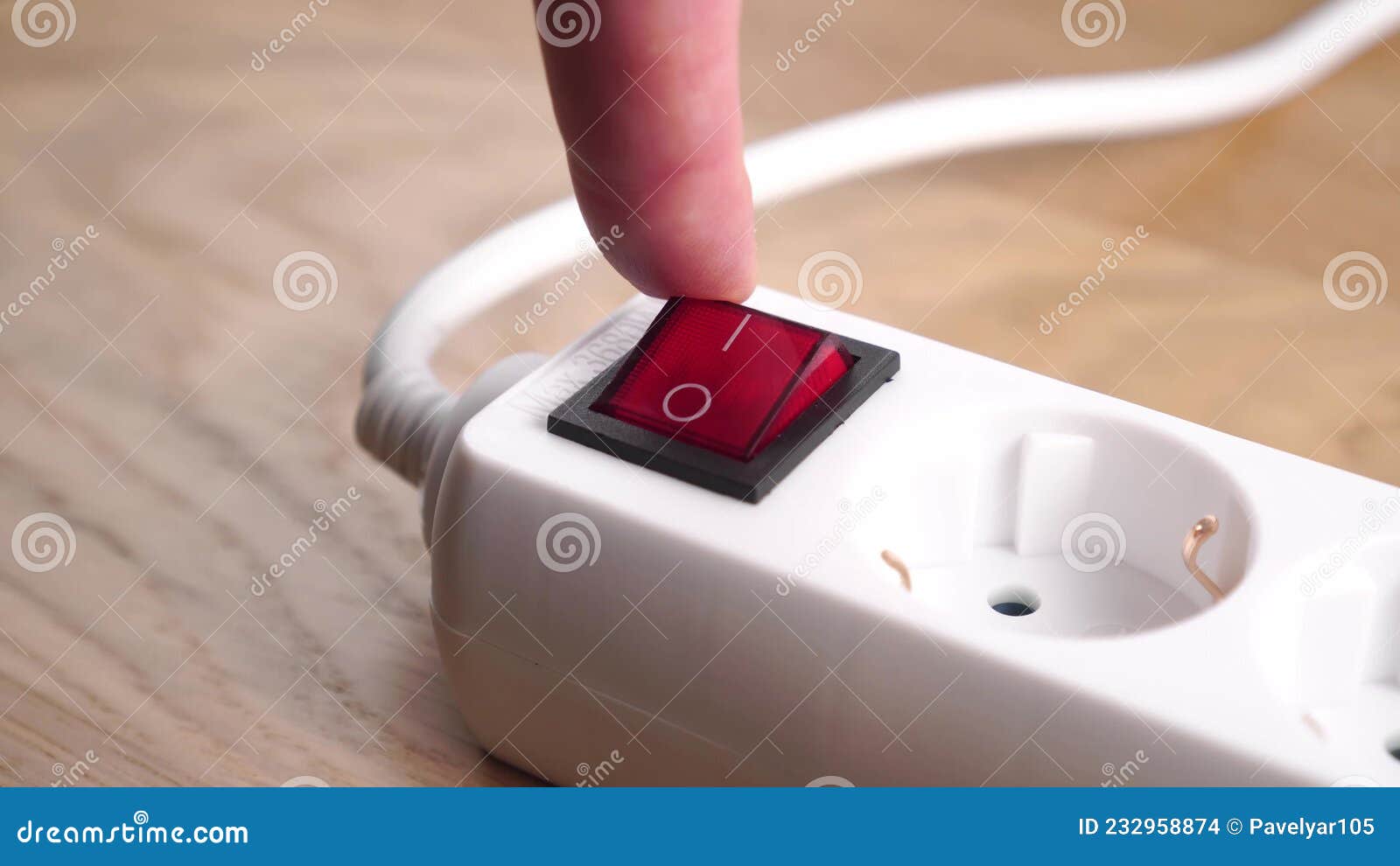 Finger Pressing the Red Button Switch of the White Electric Power Strip ...