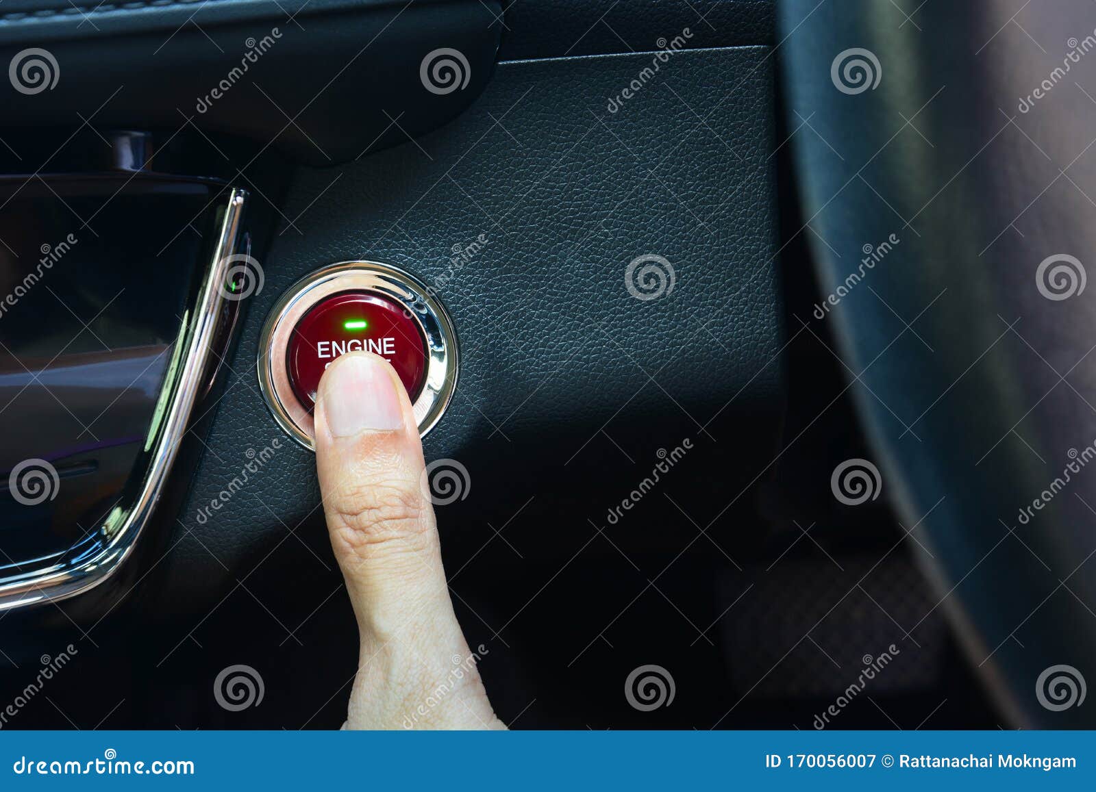 A Finger Pressing a Round Shape Red Color Start and Stop Engine Button ...