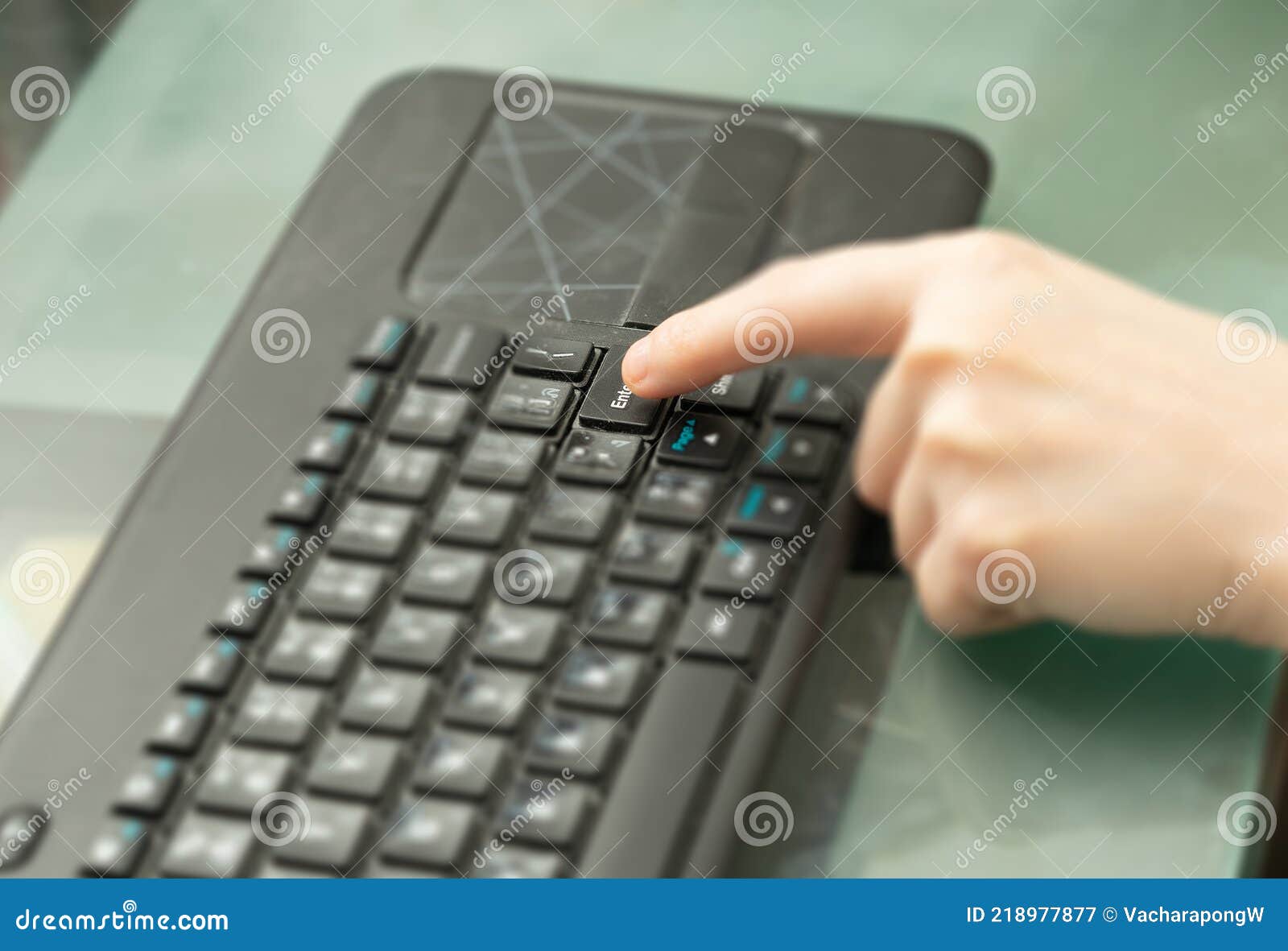 Finger Push Enter Key Button on Wireless Bluetooth Key Board on Glass ...