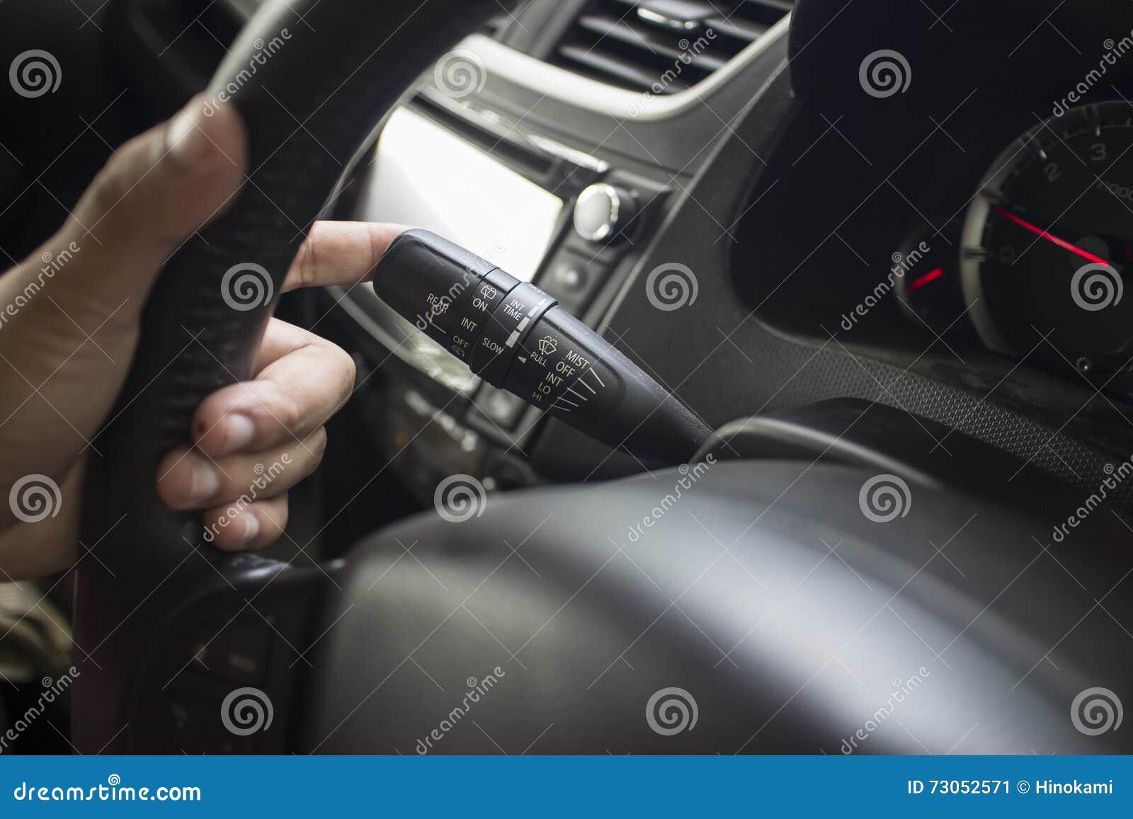 The Finger Push a Wiper Control Button on the Car Steering Wheel Stock ...