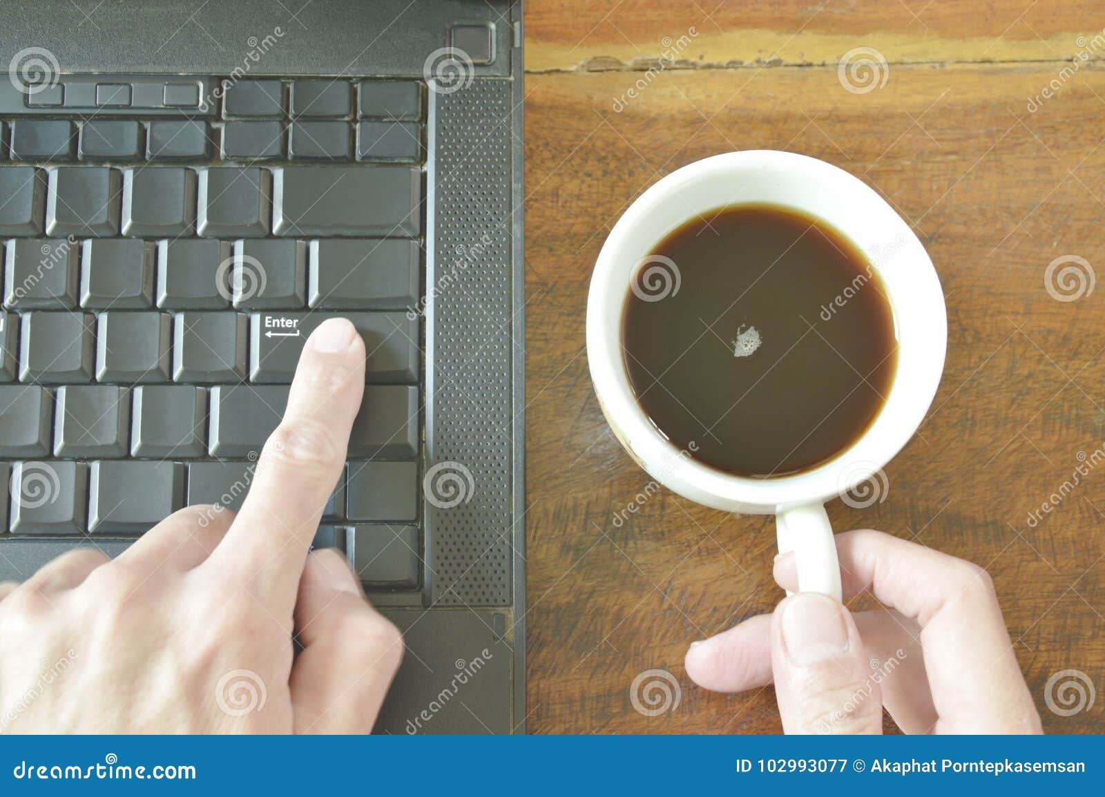 Finger Pushing Enter Button on Computer Notebook while Holding Coffee ... Finger Pushing Enter Button on Computer Notebook while Holding Coffee ...