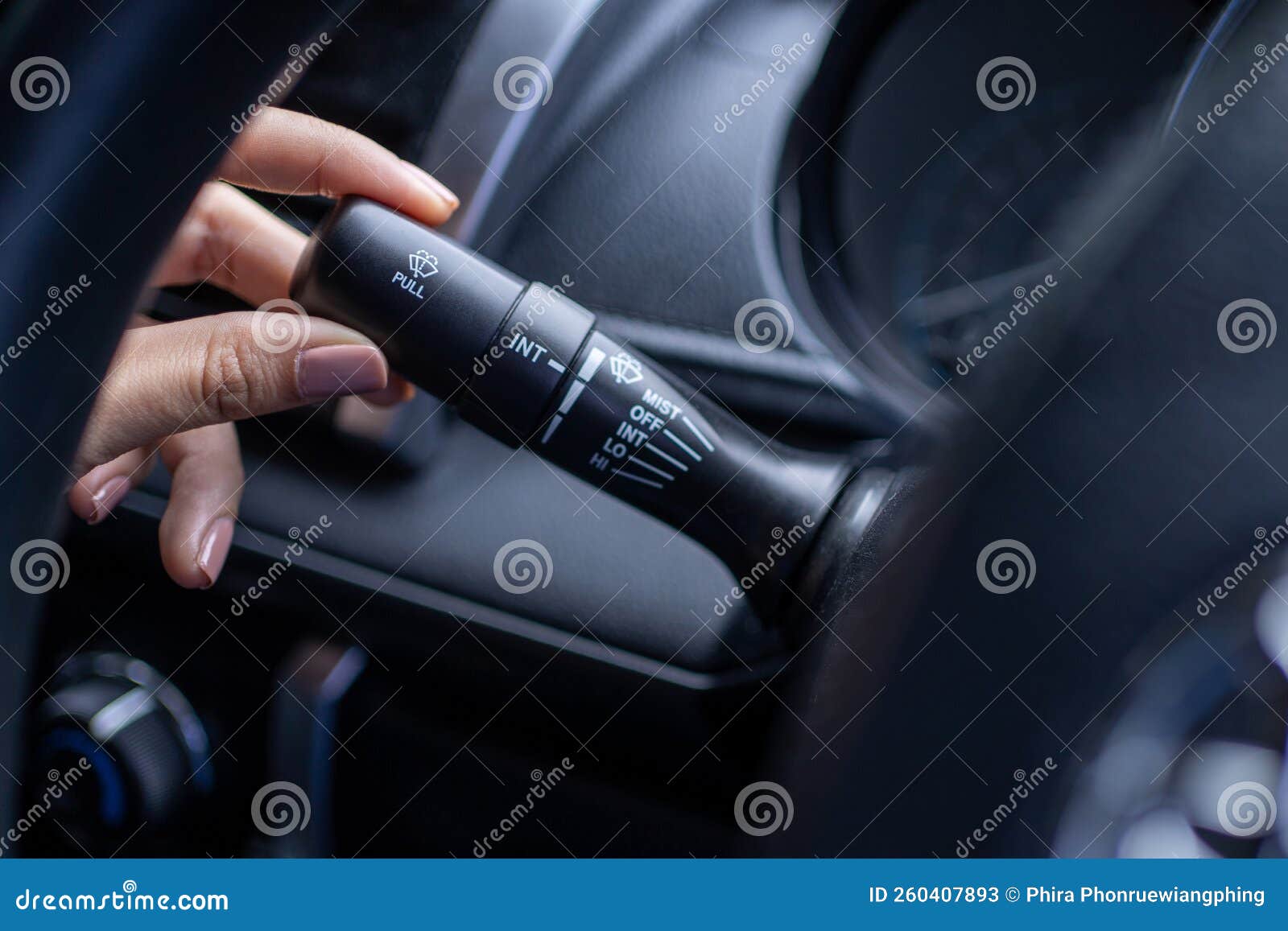 Finger is Spinning a Wiper Control Button on the Car Steering Wheel ...