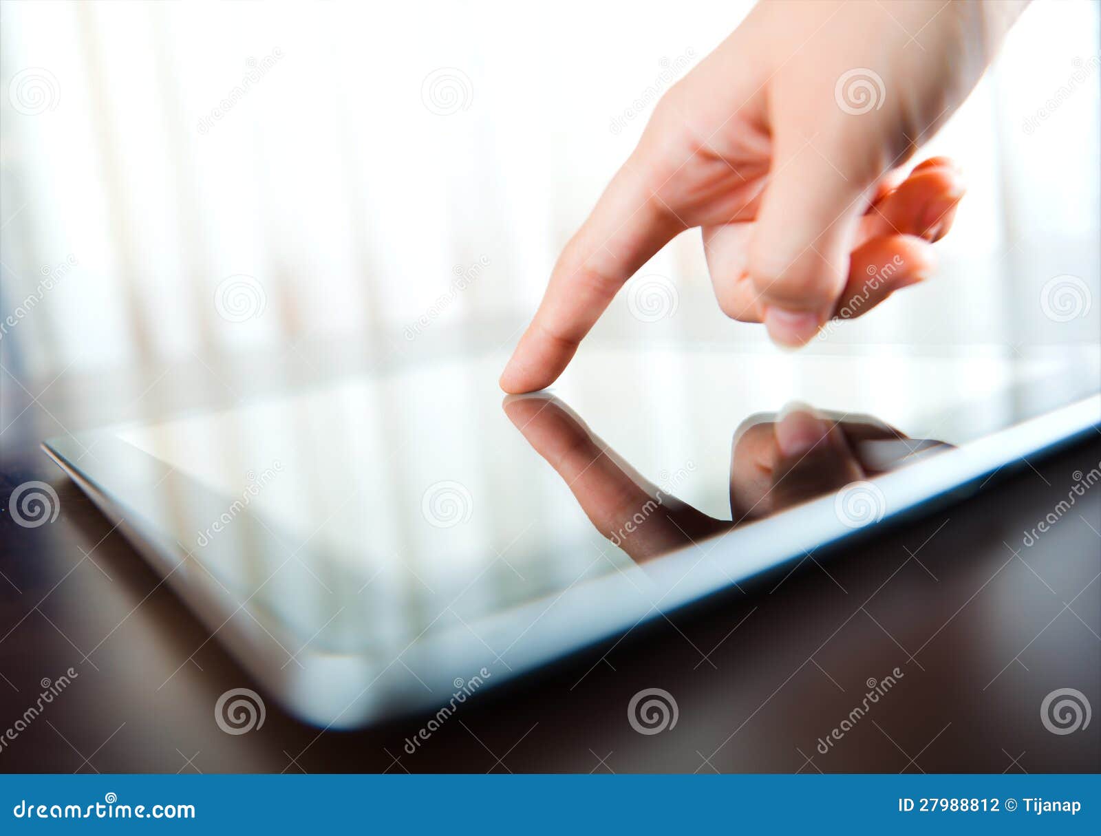 Finger touching a tablet stock photo. Image of bright - 27988812