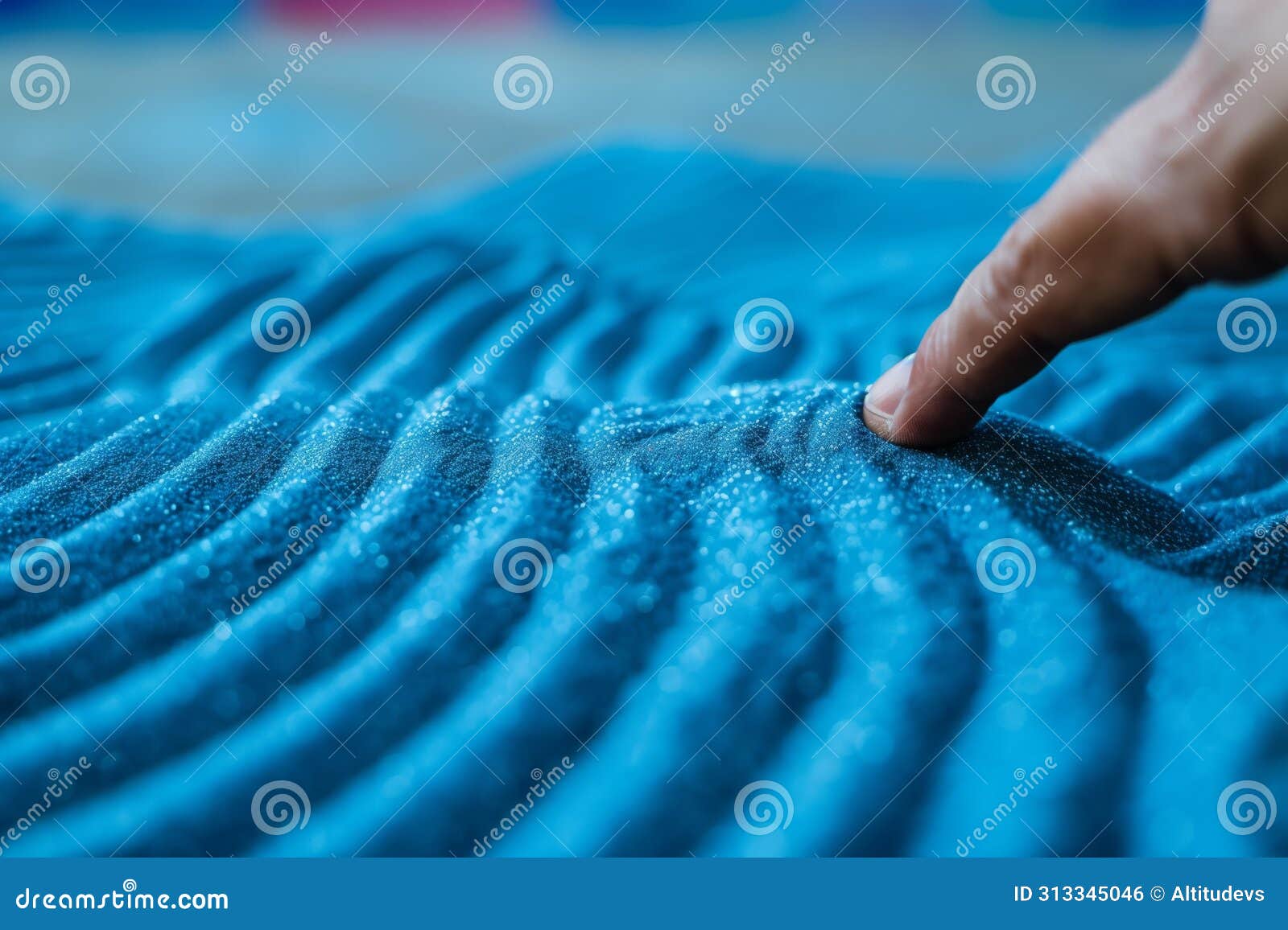 Finger Tracing Wave Patterns in Blue Sand Stock Photo - Image of ...