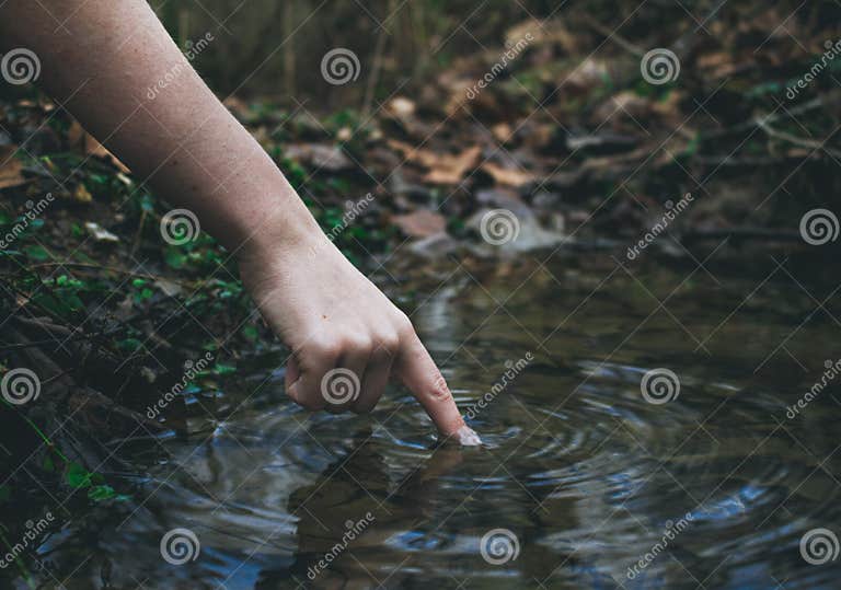 Finger in Water stock photo. Image of puddle, making - 71809672