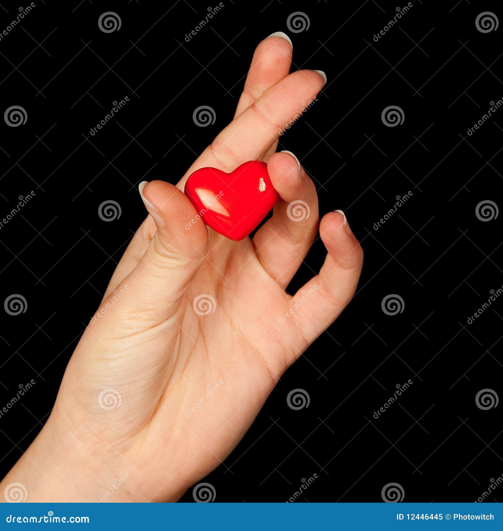 Fingers crossed with heart stock image. Image of romance - 12446445