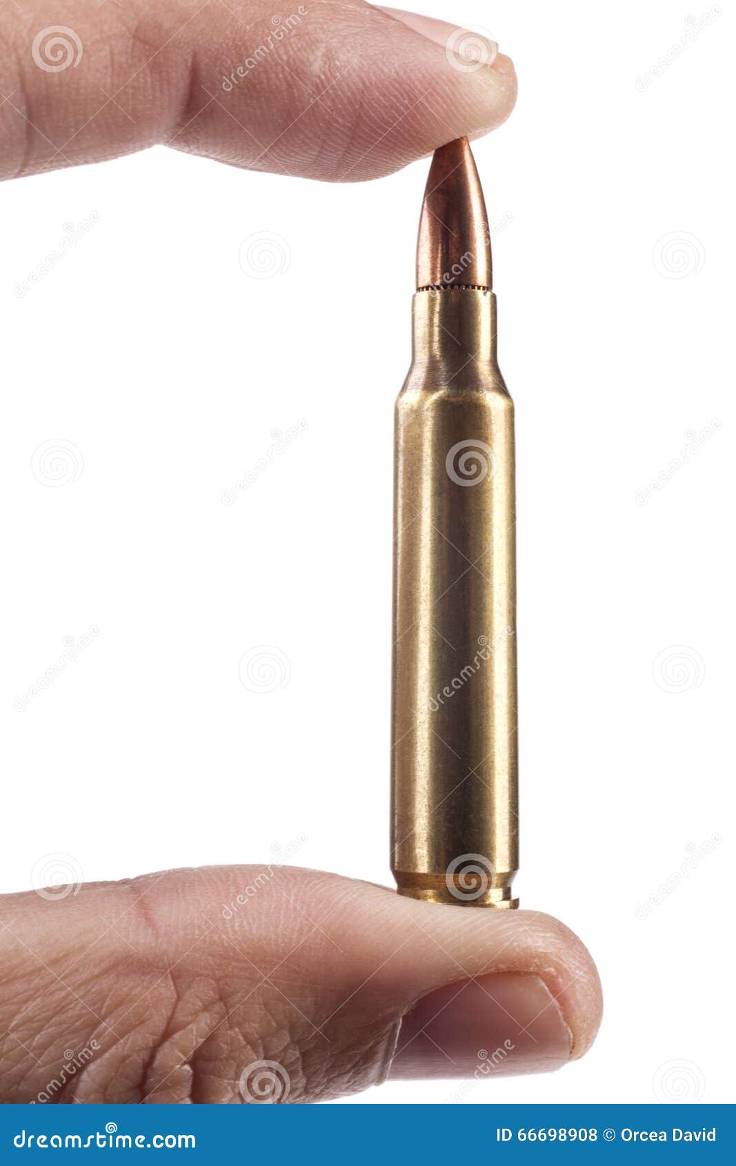 Fingers Holding Bullet stock photo. Image of equipment - 66698908