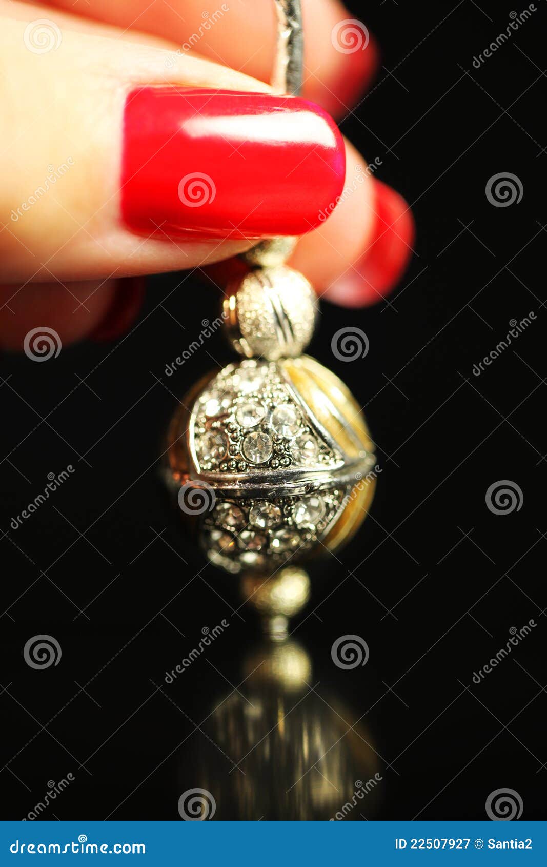 Fingers Holding Piece of Jewelry Stock Image - Image of hand, bright ...