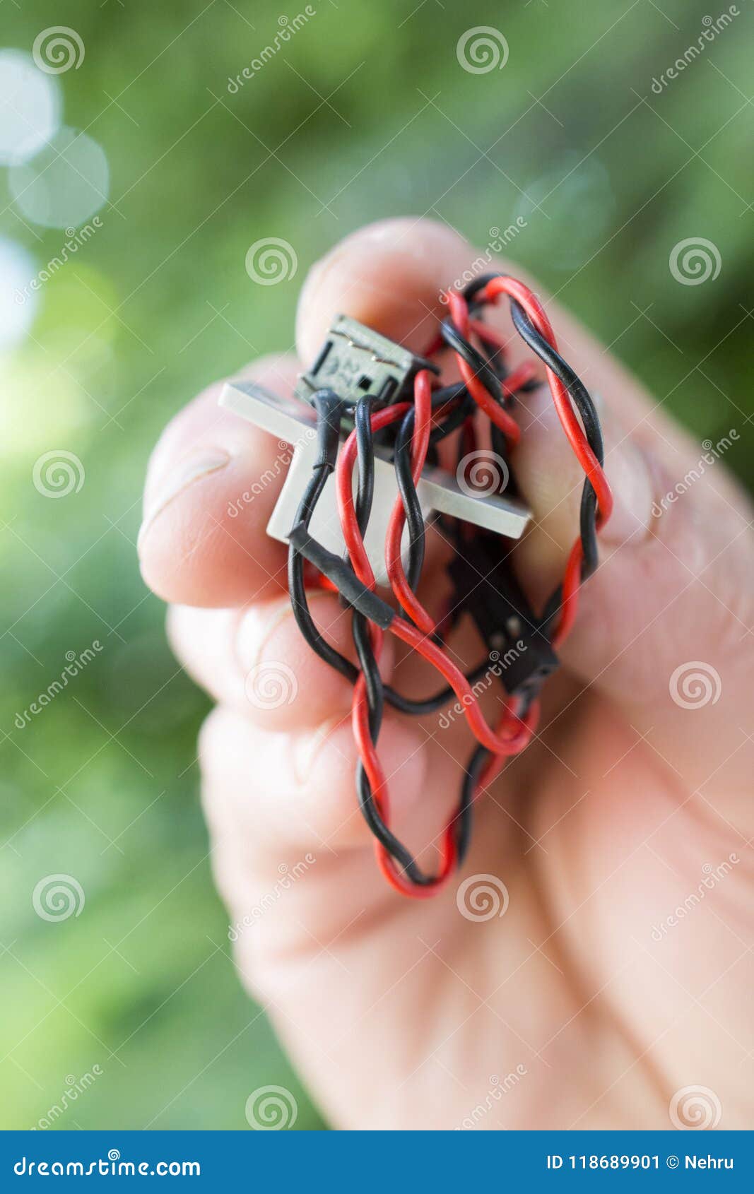 Fingers Holding Wires of a Device Stock Image - Image of hand, finger ...