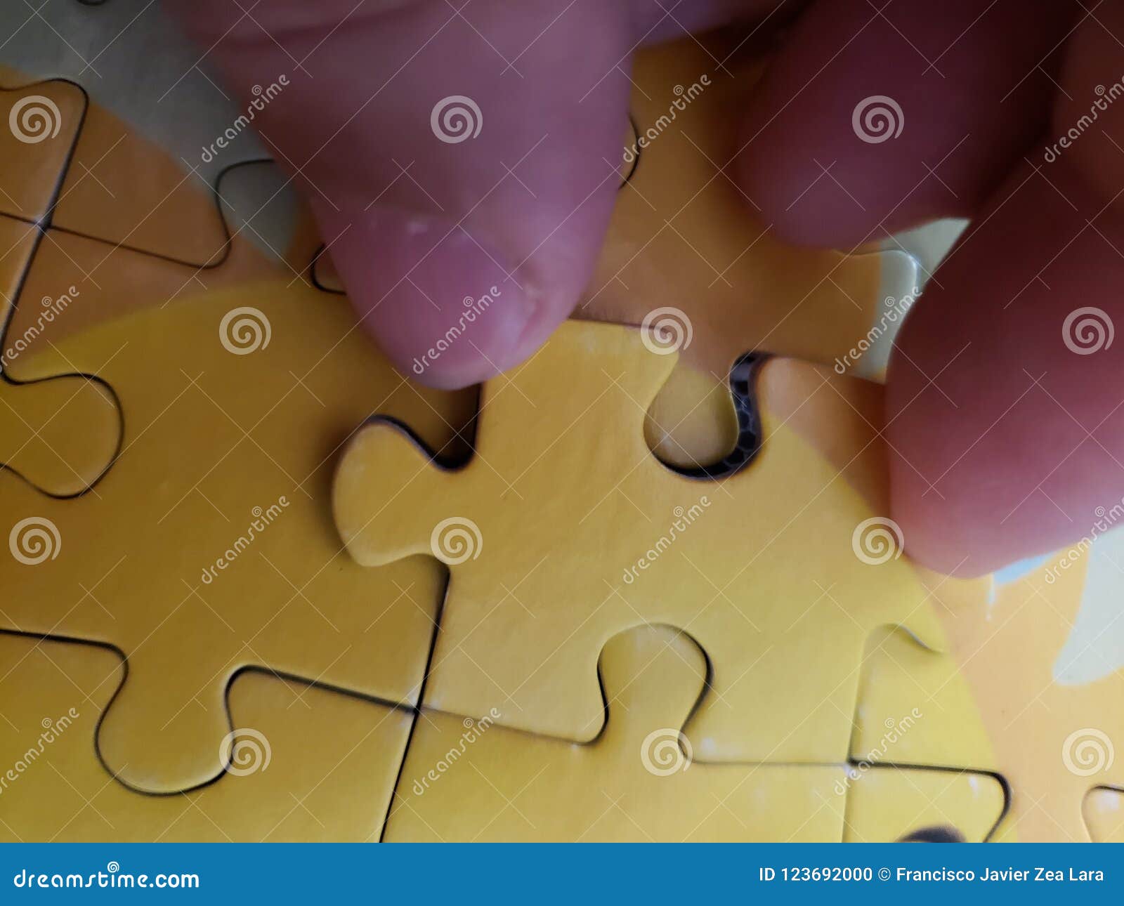 Fingers Placing the Correct Piece of the Puzzle Stock Photo - Image of ...