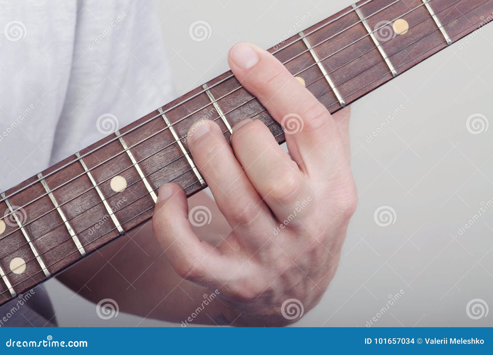 Fingers press the strings stock photo. Image of press - 101657034