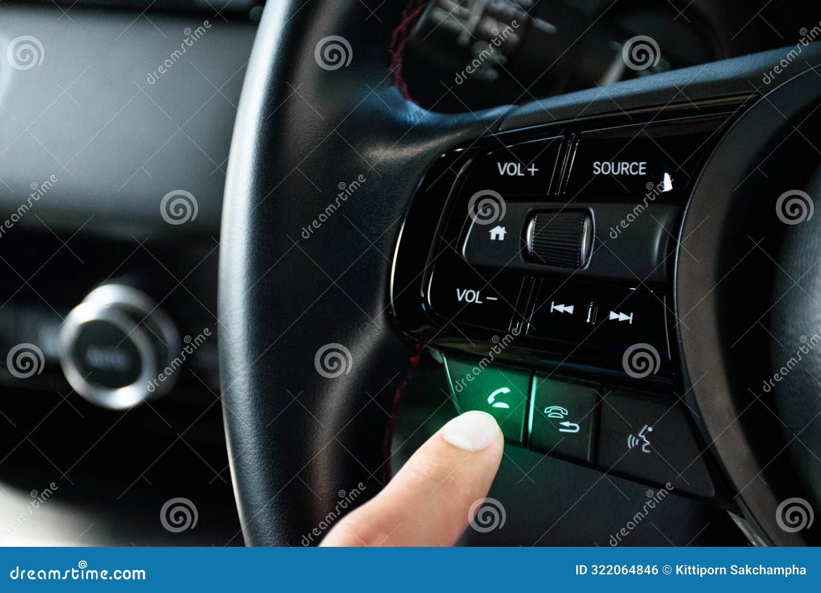 Fingers Pressing the Answer Call Button on the Car Steering Wheel with ...
