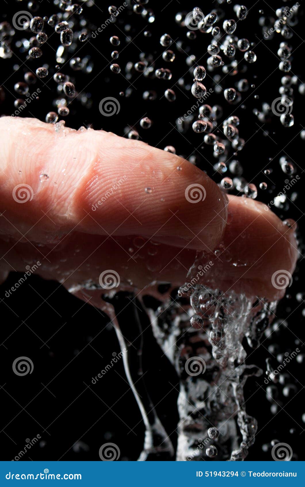 Fingers in water drops stock photo. Image of black, colors - 51943294