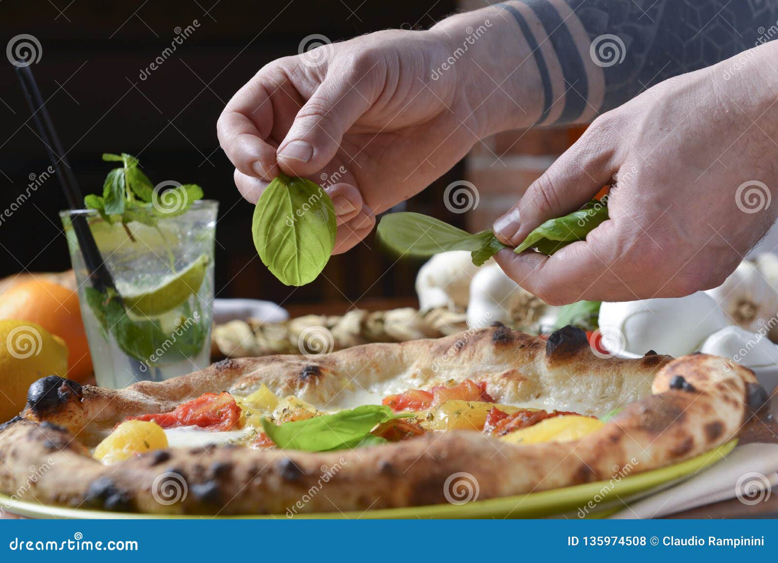 Finish dressing pizza stock photo. Image of basil, tomatoe - 135974508