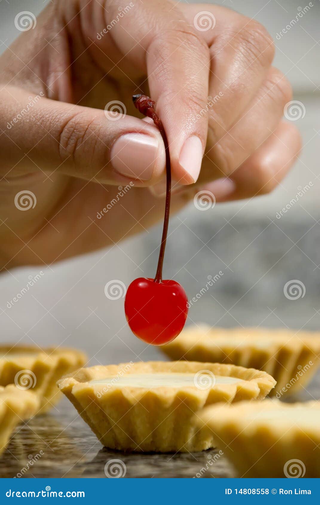 Finishing Touch with Cherry Stock Photo - Image of gourmet, hands: 14808558