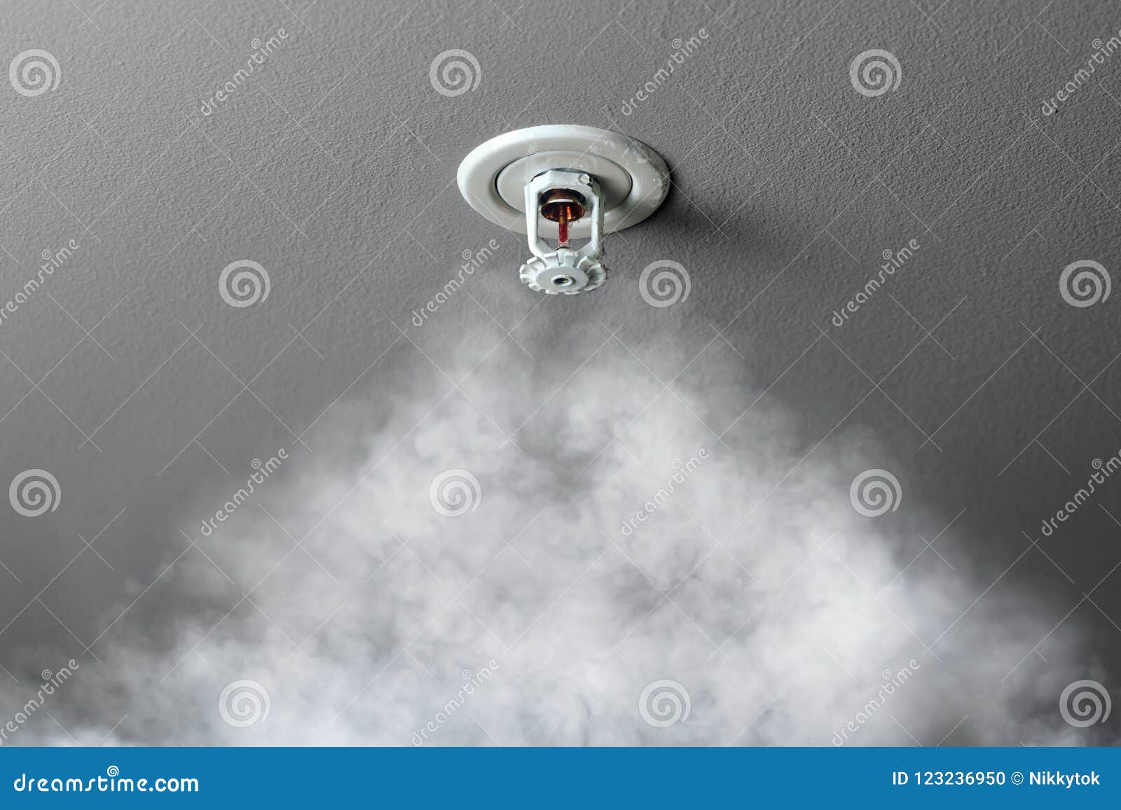 Fire Alarm Sprinkler System in Action with Smoke Stock Photo - Image of ...