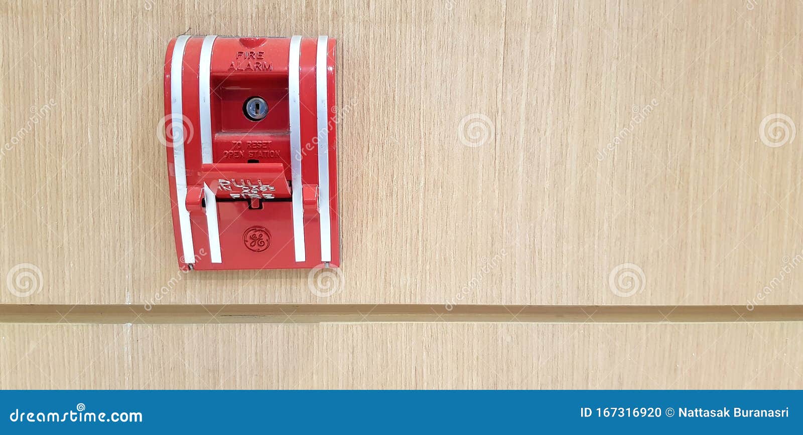Fire Alarm Switch Box for Pull in Case of Fire Isolated on Light Brown ...