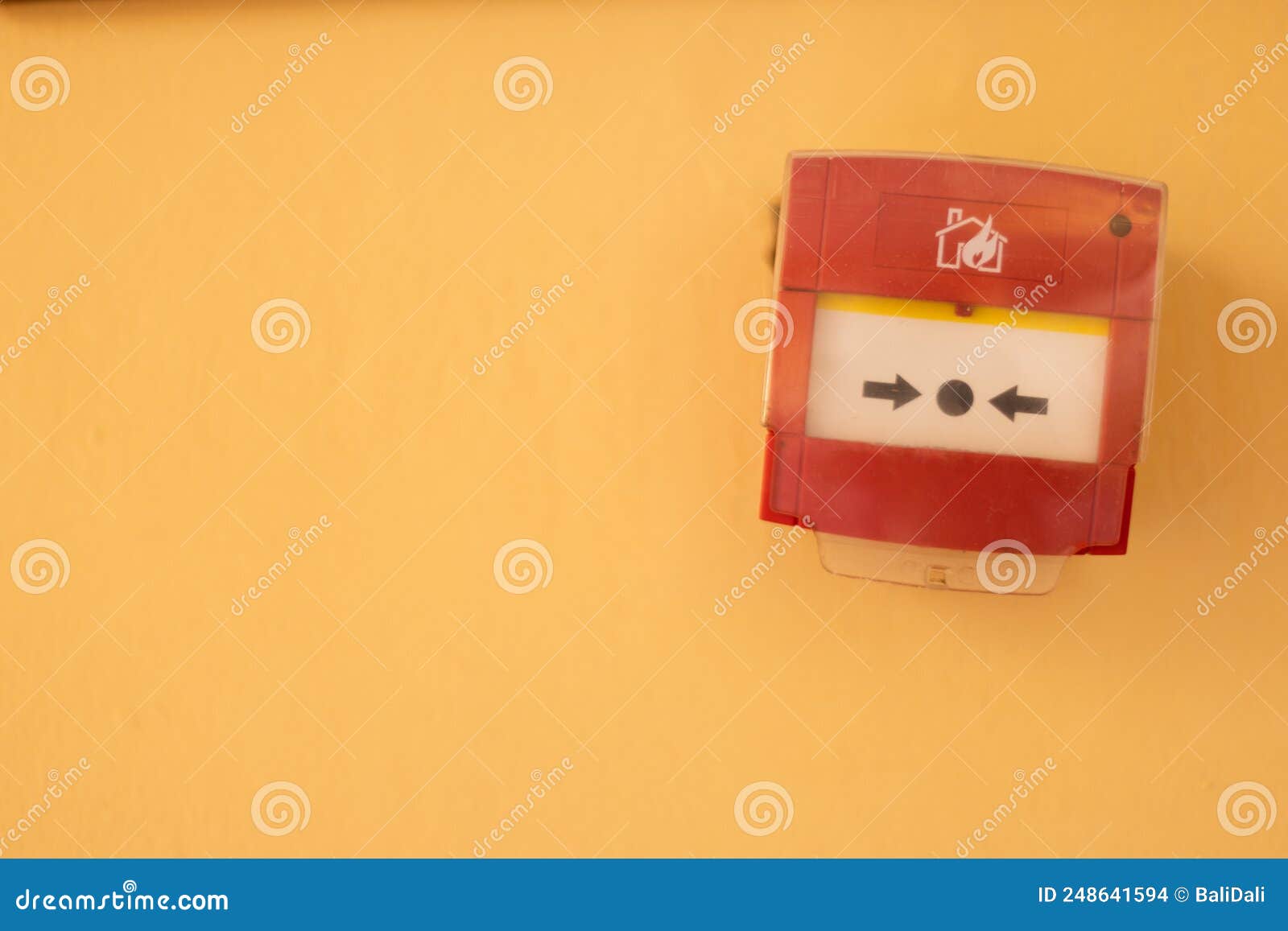 Fire Alarm System Button on a Yellow Wall. Copy Space. Stock Photo ...
