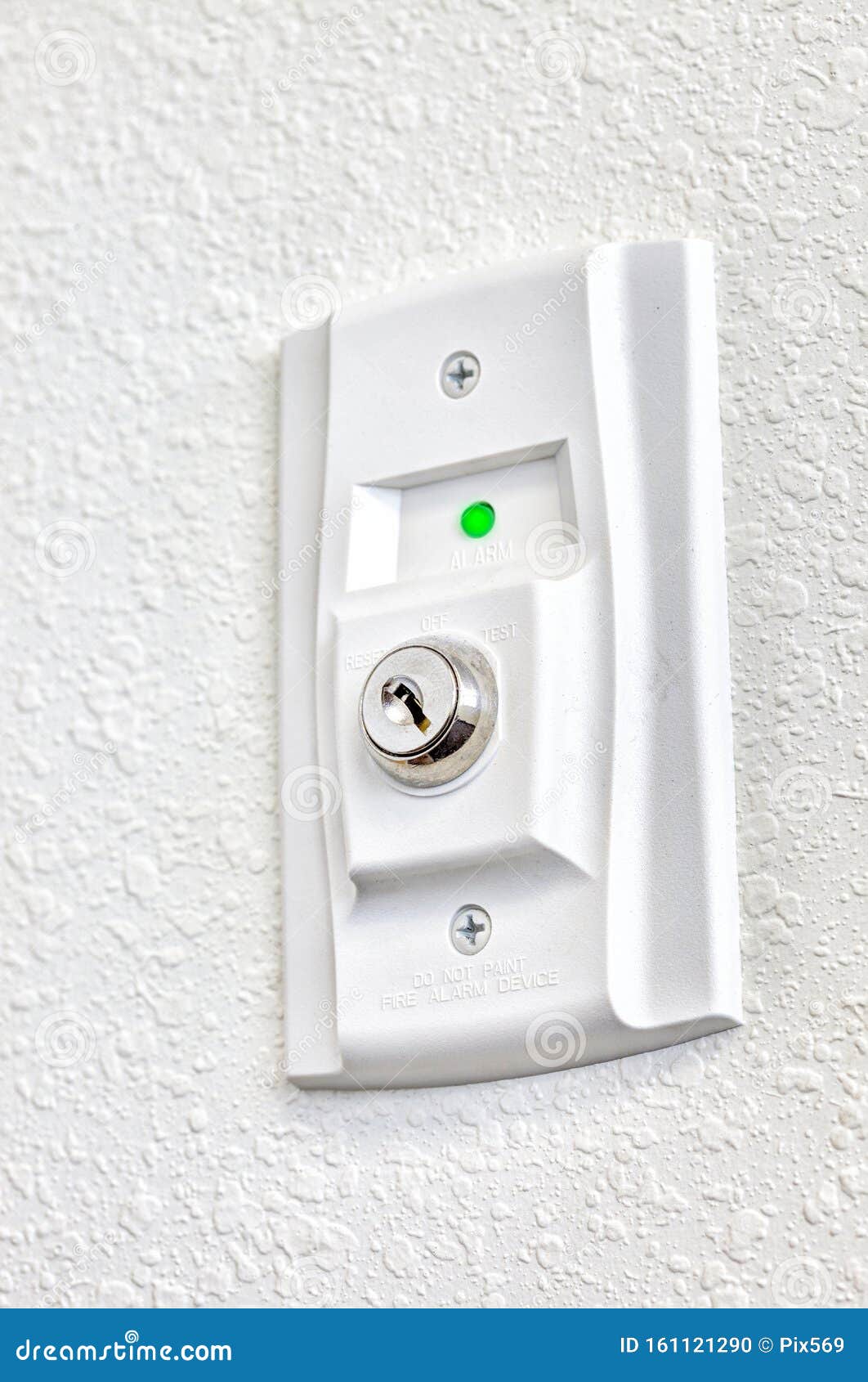 A fire alarm test switch. stock photo. Image of green - 161121290
