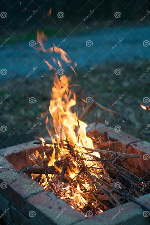 Fire in backyard at night stock image. Image of cookout - 146477423
