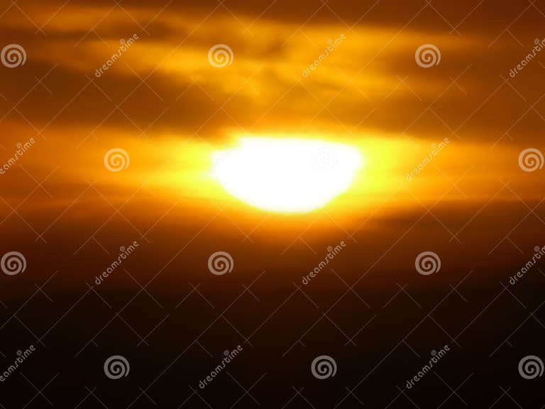 Fire ball sun at sunset stock photo. Image of tinted - 146558020