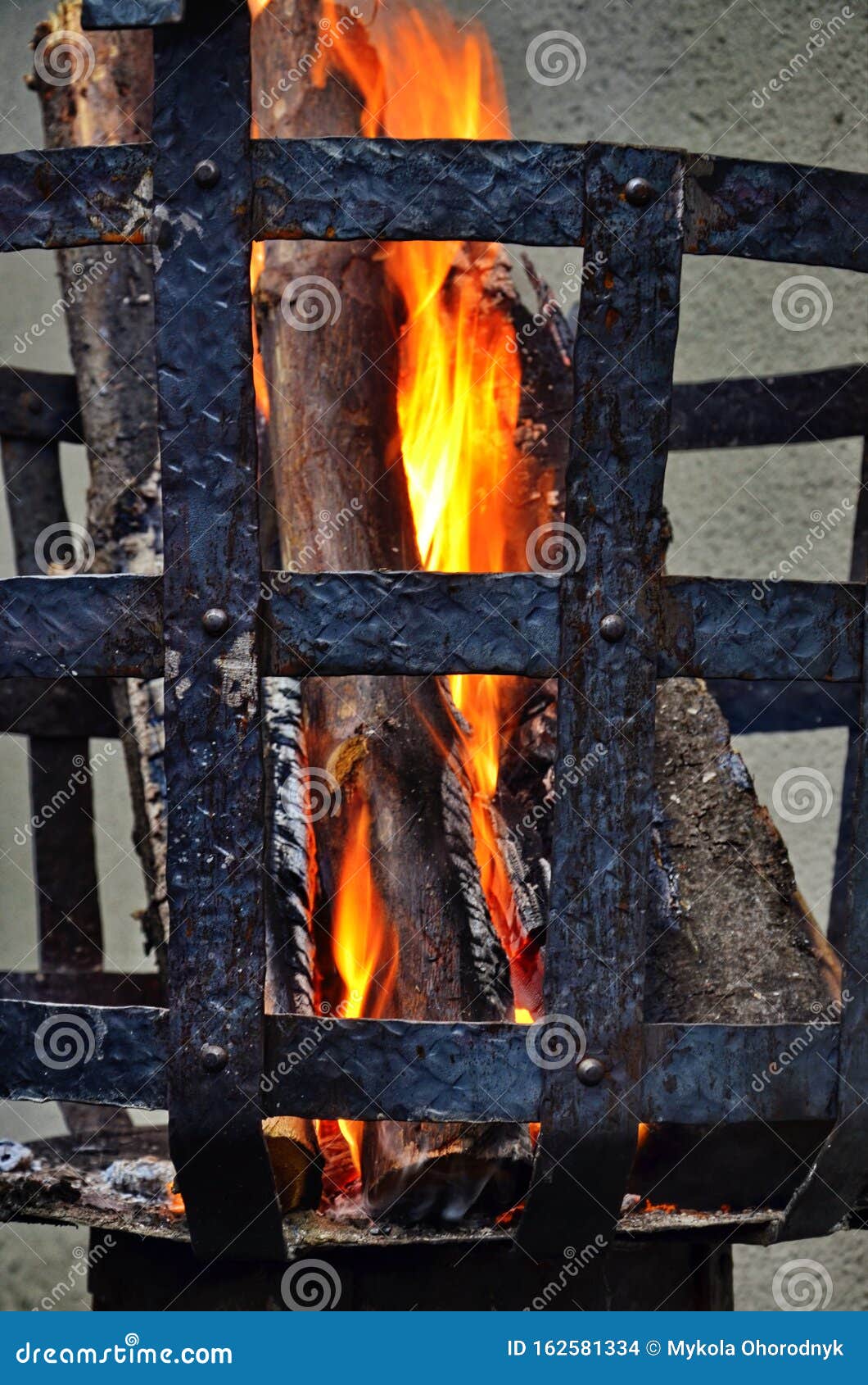 Fire in a fire basket stock photo. Image of background - 162581334