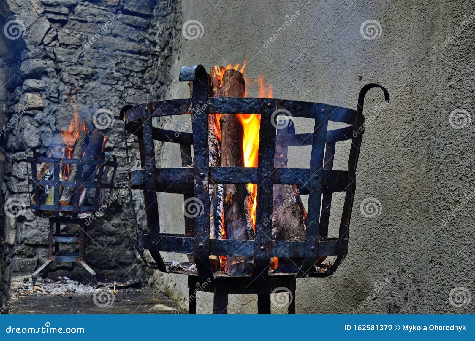 Fire in a fire basket stock image. Image of danger, flames - 162581379