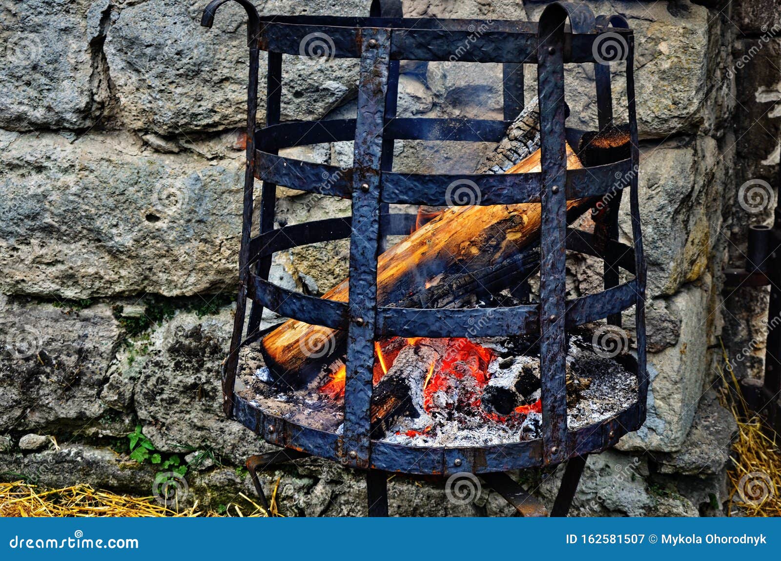 Fire in a fire basket stock image. Image of flames, open - 162581507