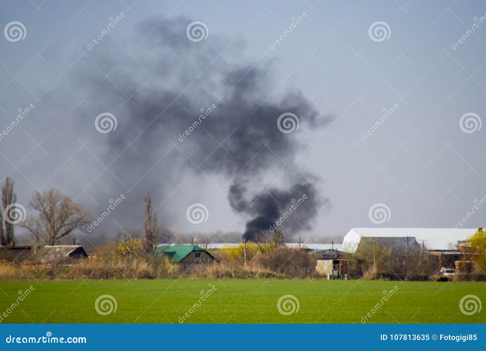 Fire and Black Smoke Outside the Village. Soot from Burning. Stock ...
