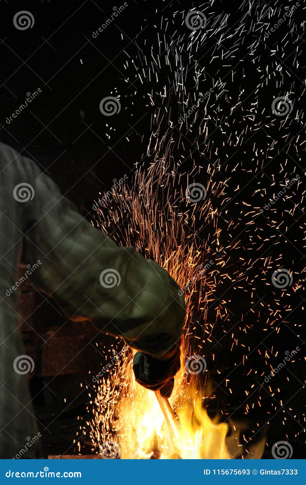 Fire on a Blacksmith. Blacksmith at Work. Dark Background. Splinters of ...