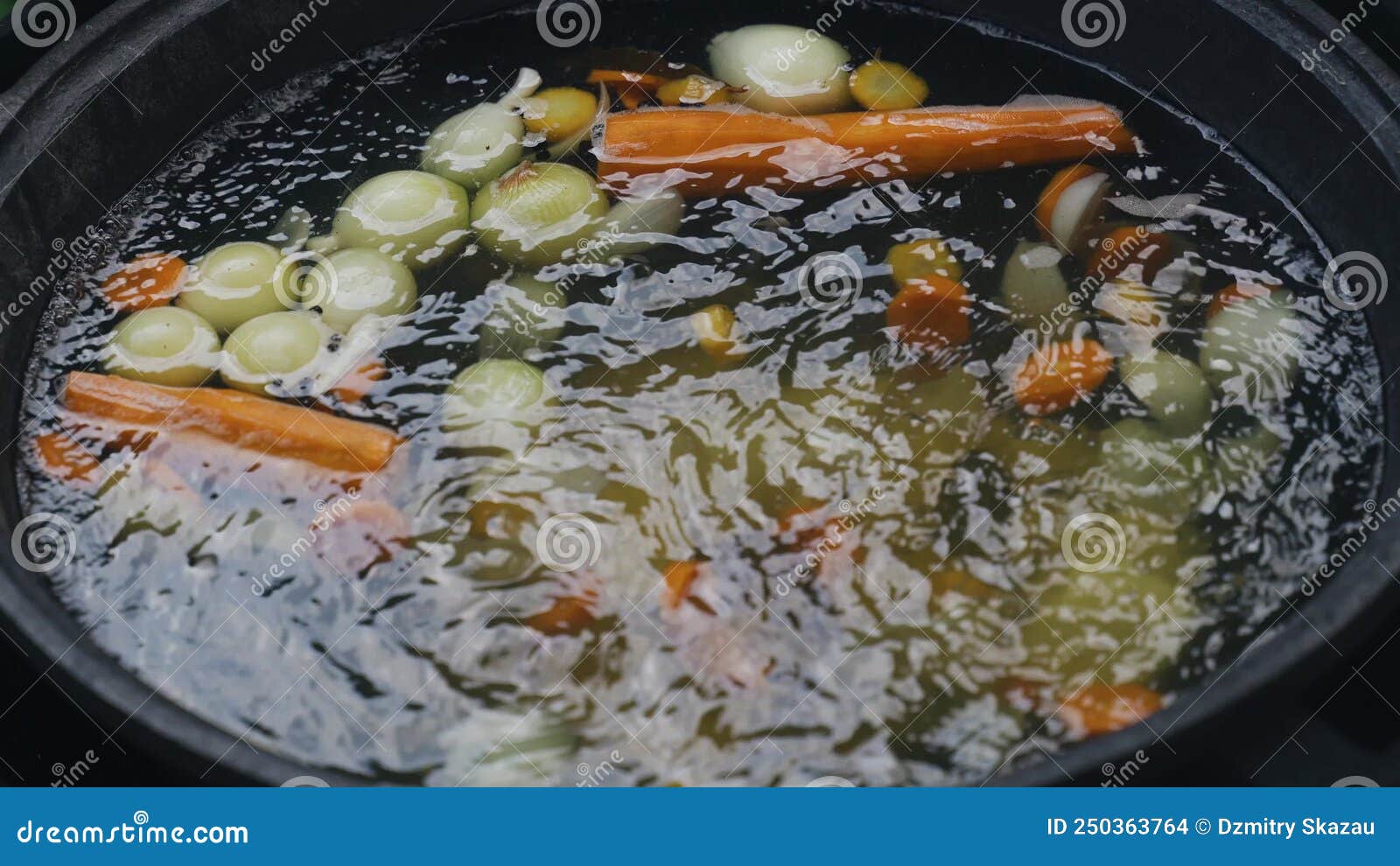 On the Fire is a Brazier with Boiling Water and Vegetables. Stock ...
