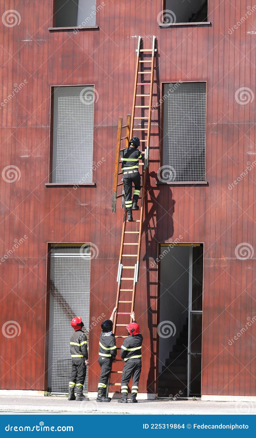 Fire Brigade Team Performing an Exercise in Using the Stairs To Stock ...
