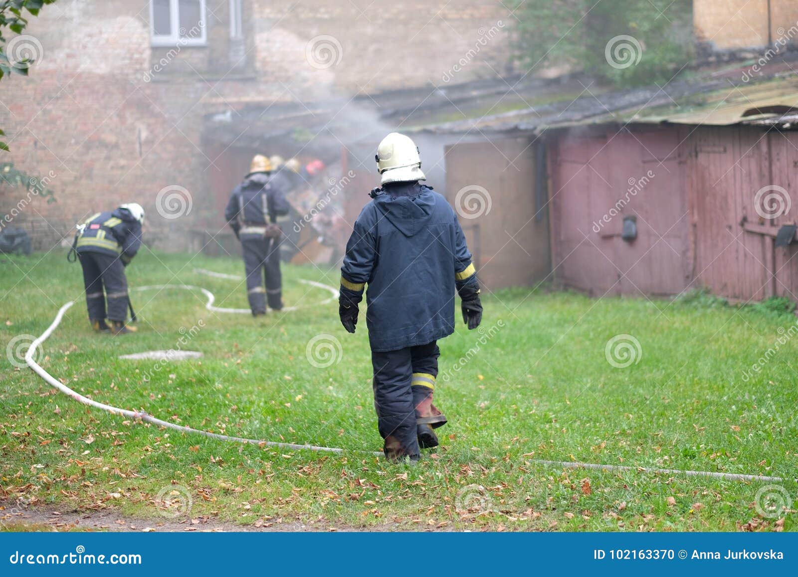 Fire brigade at work editorial image. Image of helmet - 102163370